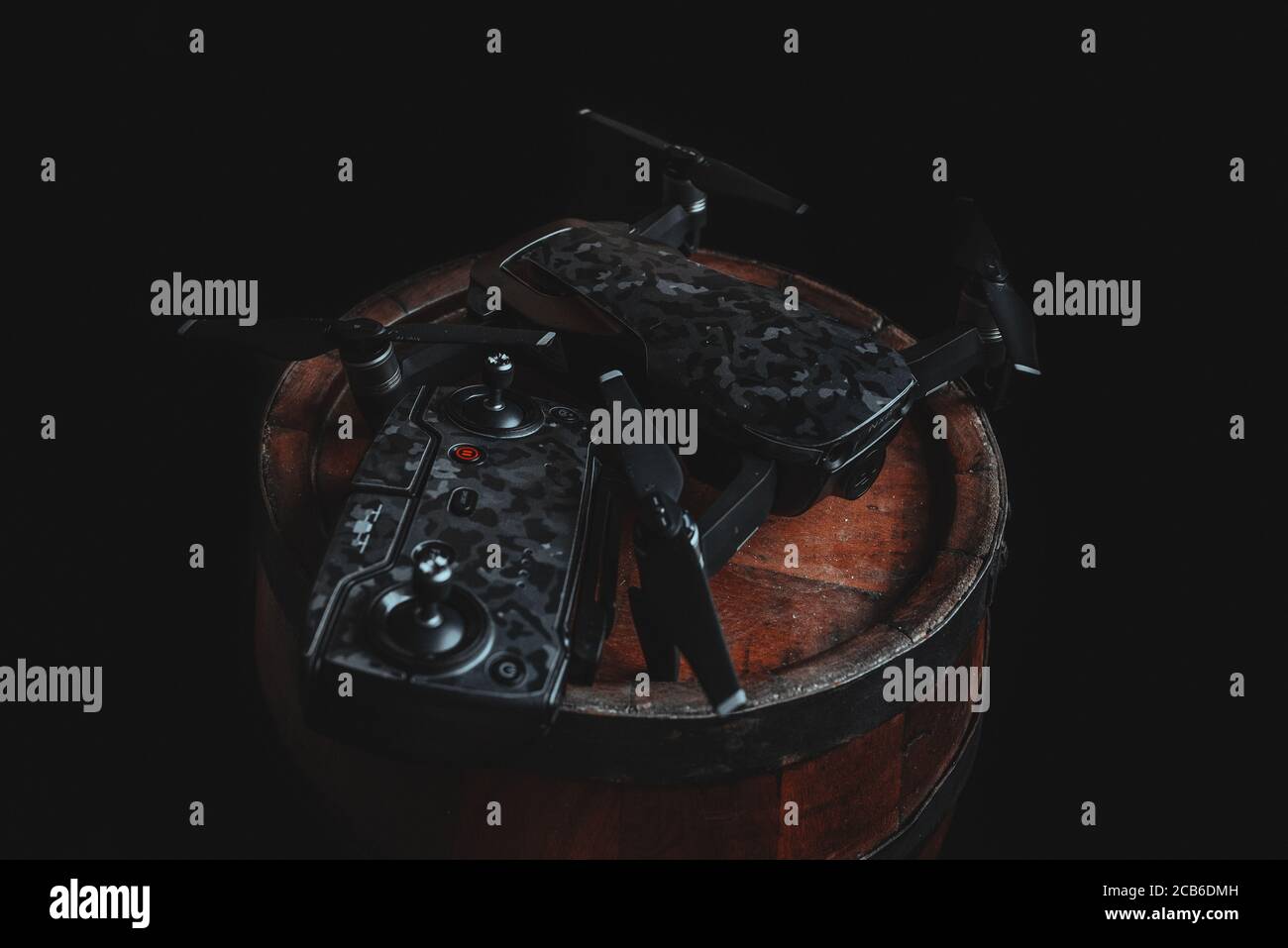 Black drone on a wine barrel in the dark room Stock Photo - Alamy