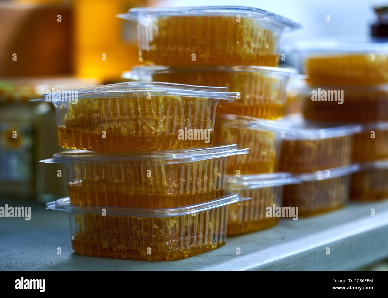 Boxes with honeycombs with cappings full of honey Stock Photo - Alamy