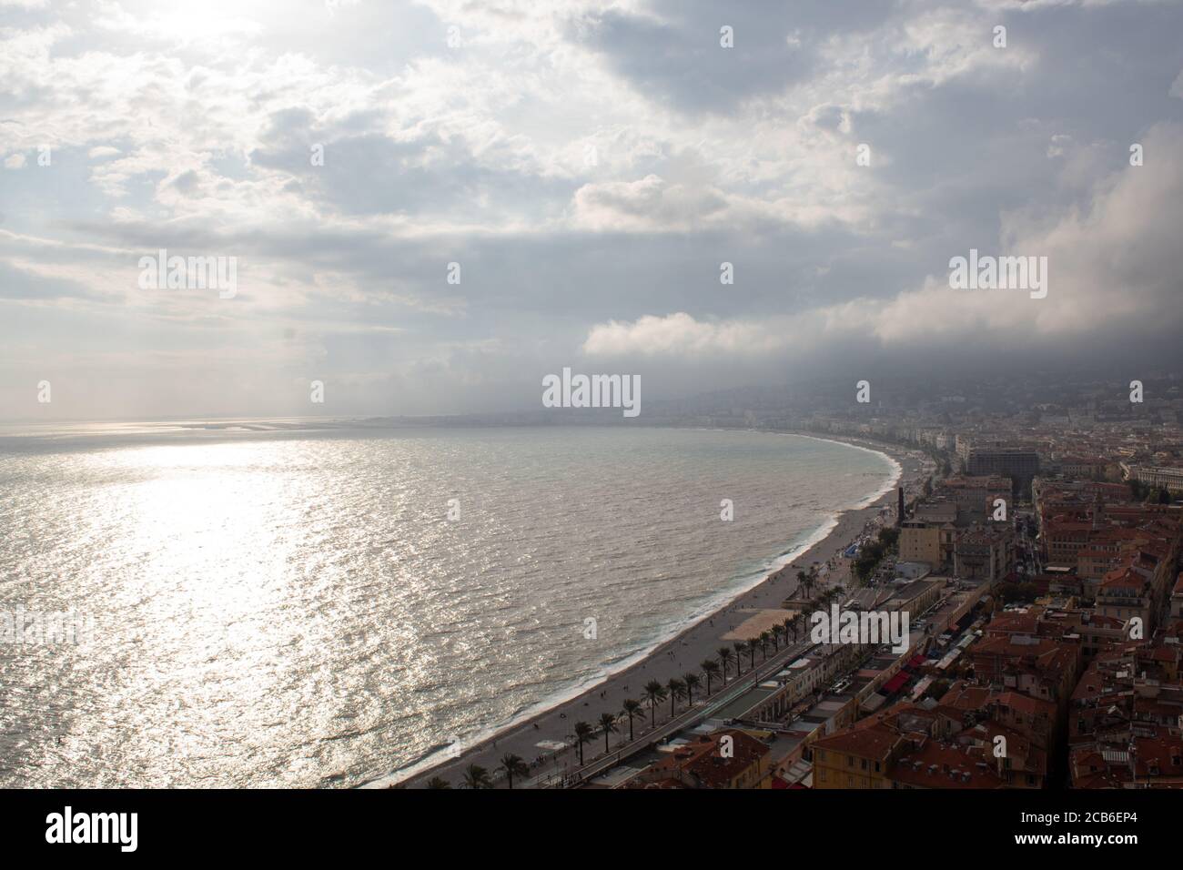 Wavy ocean hitting the sandy beach in Nice, France Stock Photo - Alamy