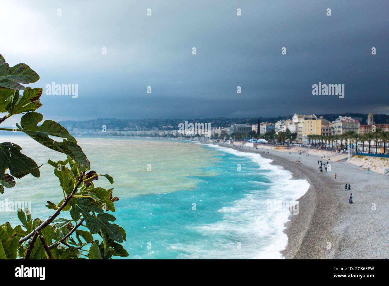 Wavy ocean hitting the sandy beach in Nice, France Stock Photo - Alamy