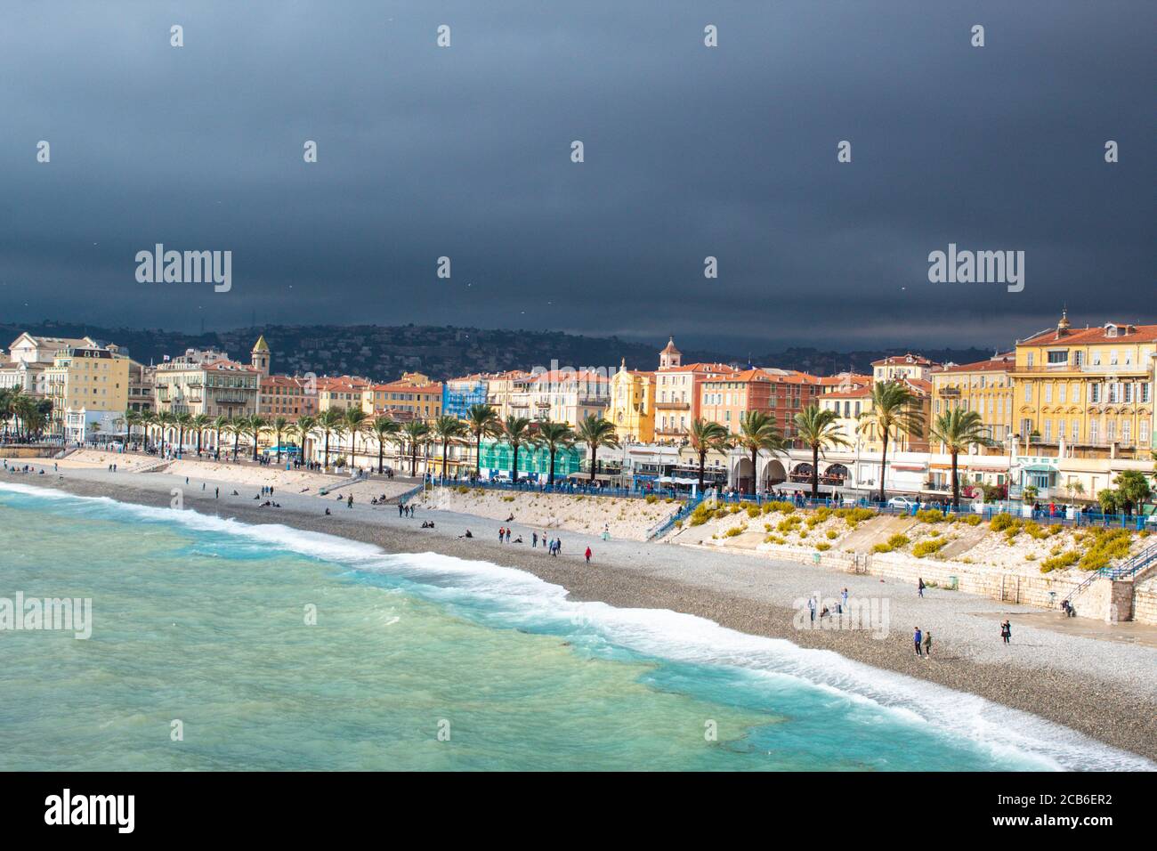 Wavy ocean hitting the sandy beach in Nice, France Stock Photo - Alamy