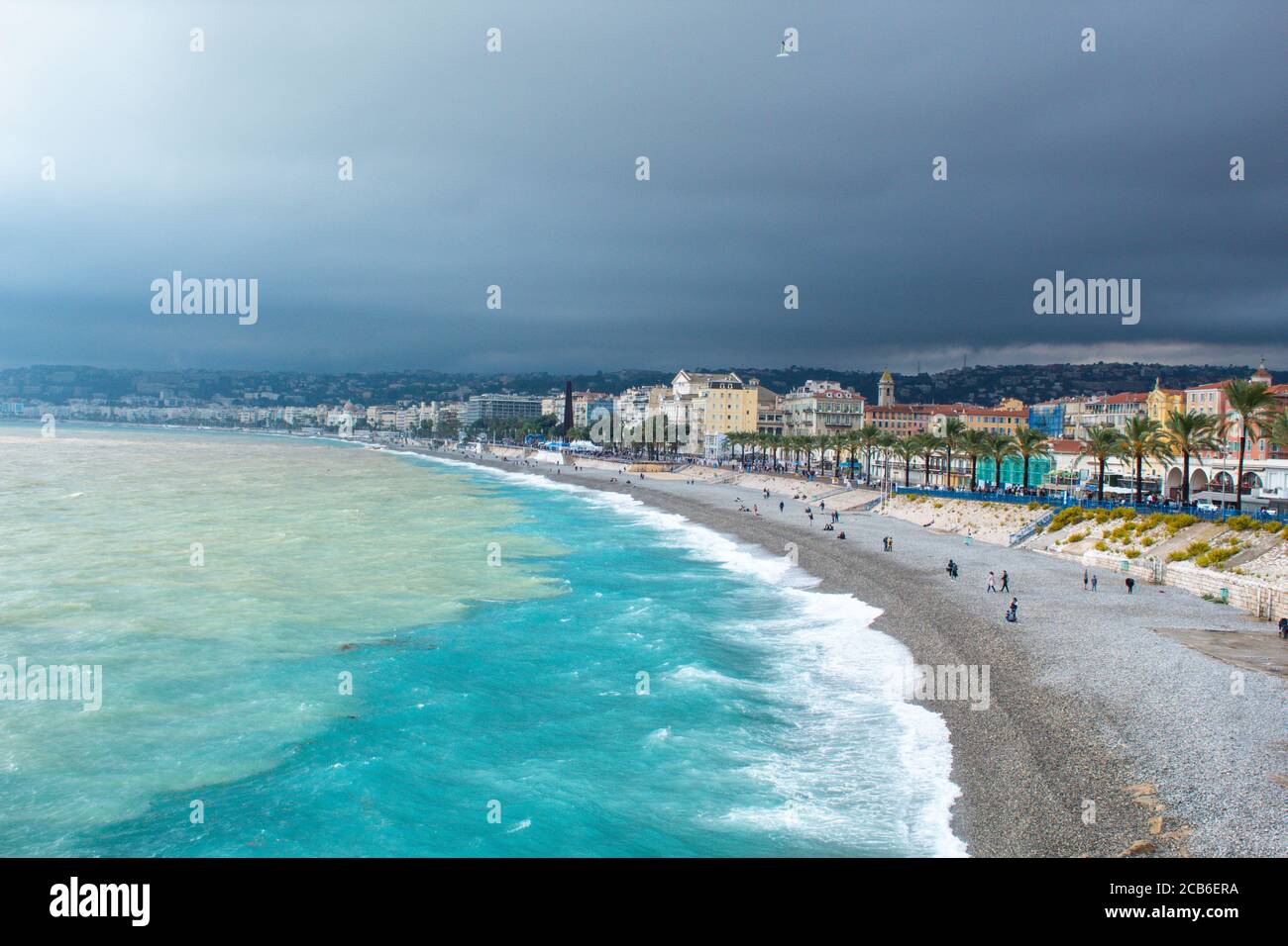Wavy ocean hitting the sandy beach in Nice, France Stock Photo - Alamy