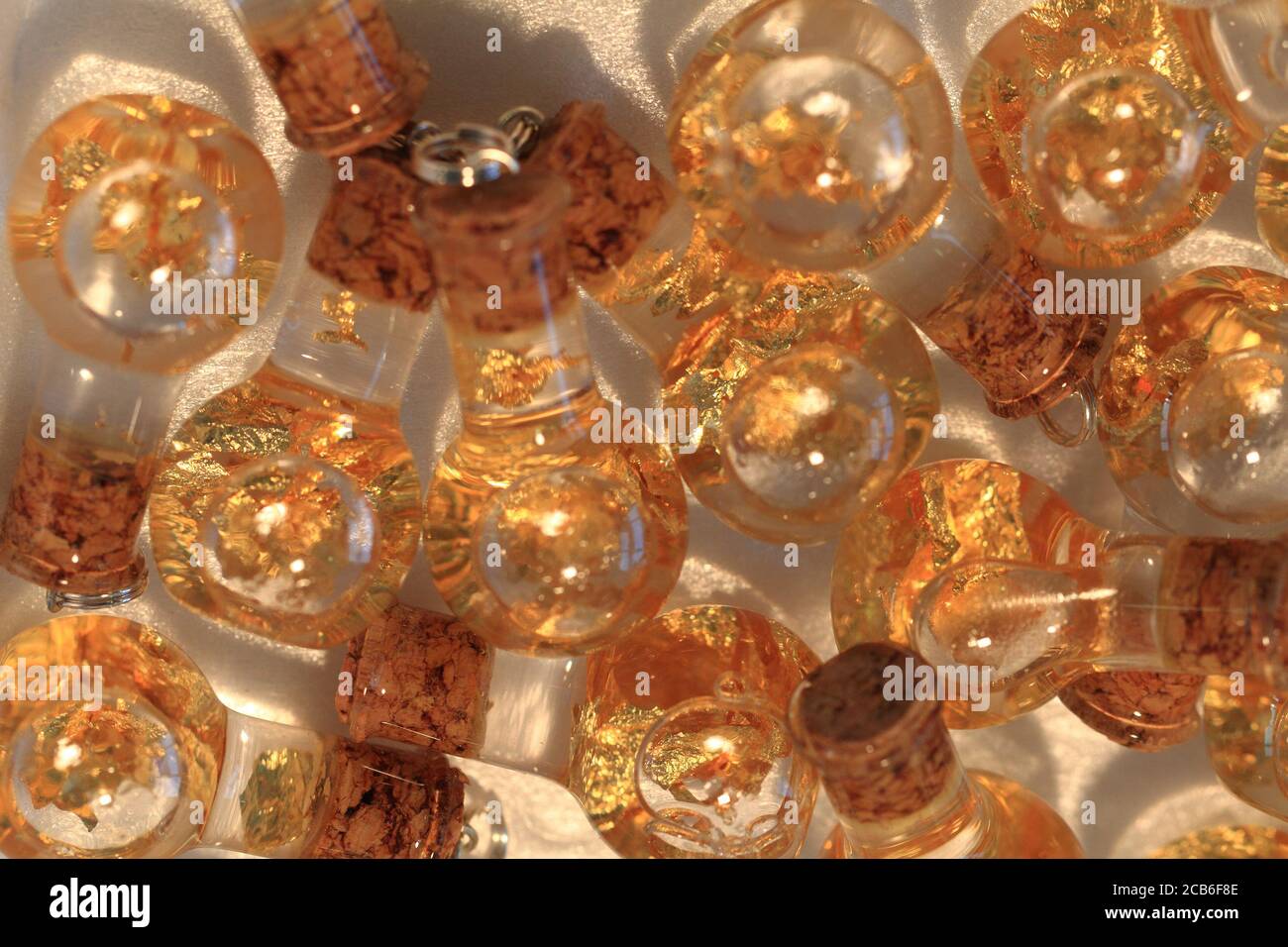 gold in the glass bottles of water as nice background Stock Photo - Alamy
