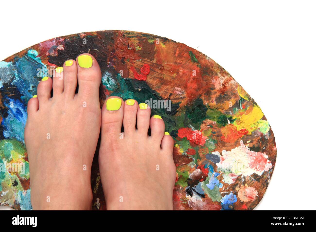 women feet (pedicure) with color palette isolated on the white ...