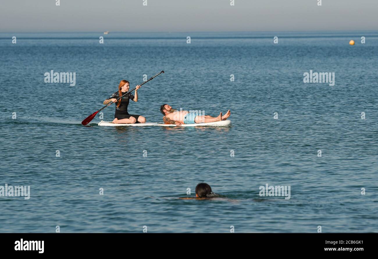 Sunbathing on paddle board hi-res stock photography and images - Alamy