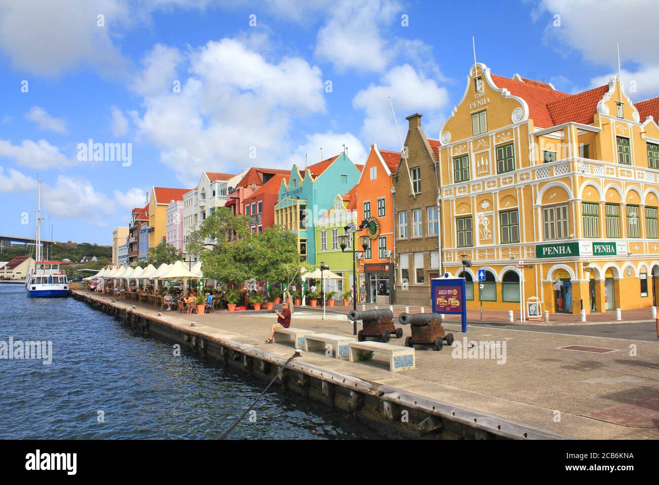 WILLEMSTAD, CURACAO - FEBRUARY 11, 2014: Colorful waterfront buildings ...