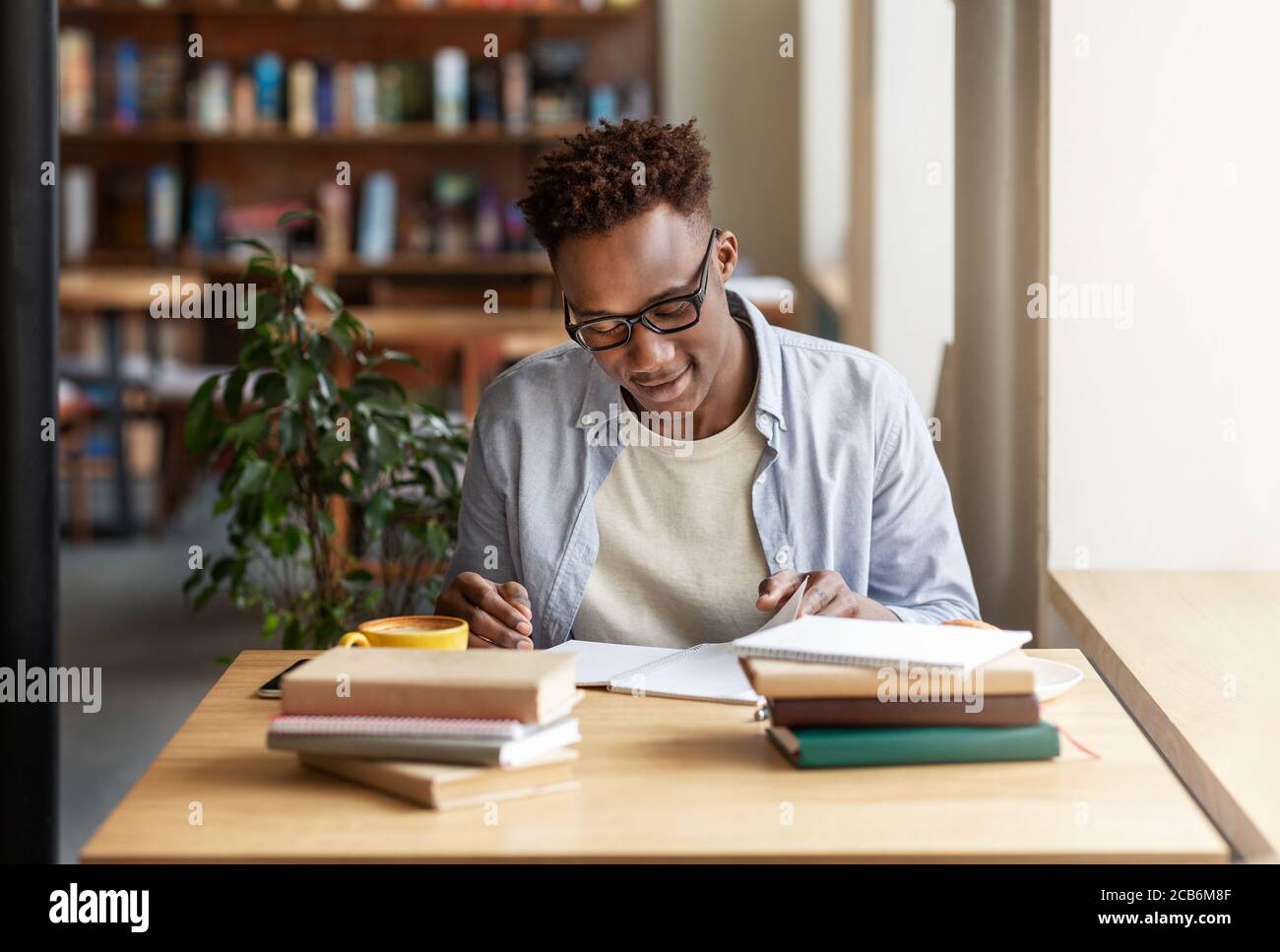 African american man working studying hi-res stock photography and ...
