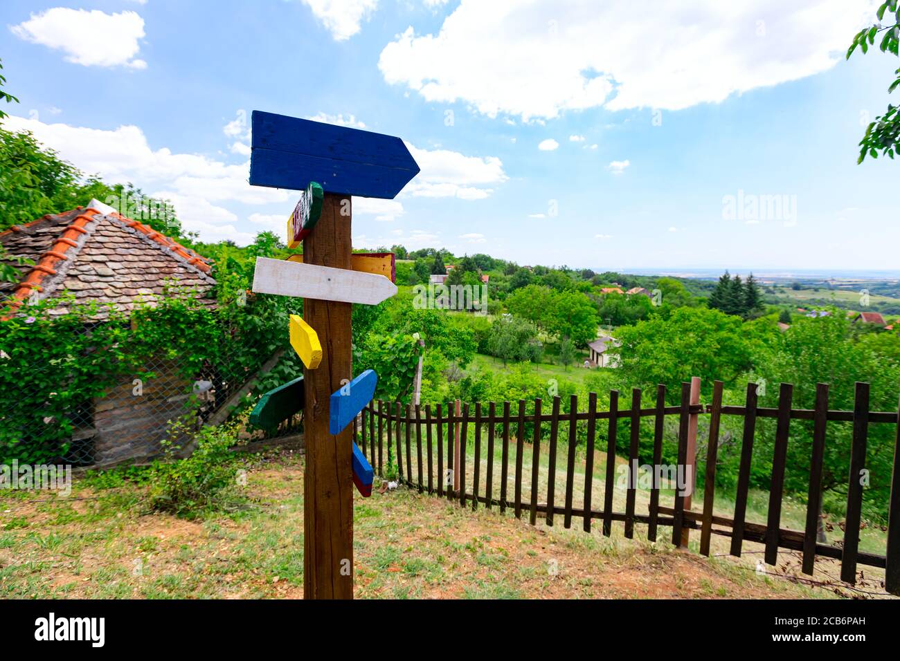 Wooden colorful arrow shape signs, points the way to the different ...