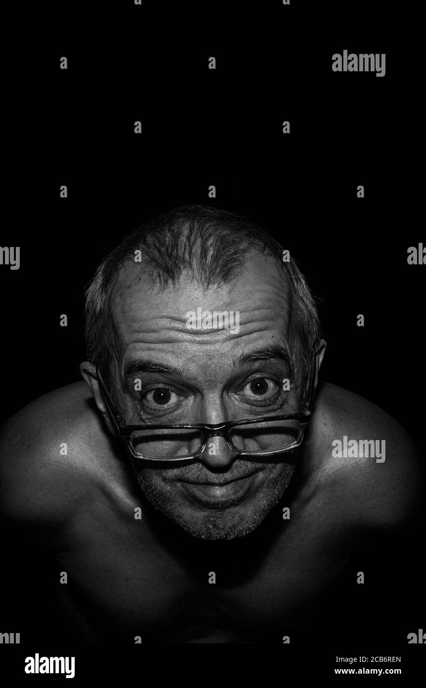 A toady who smiles and bows to his master in black and white Stock ...