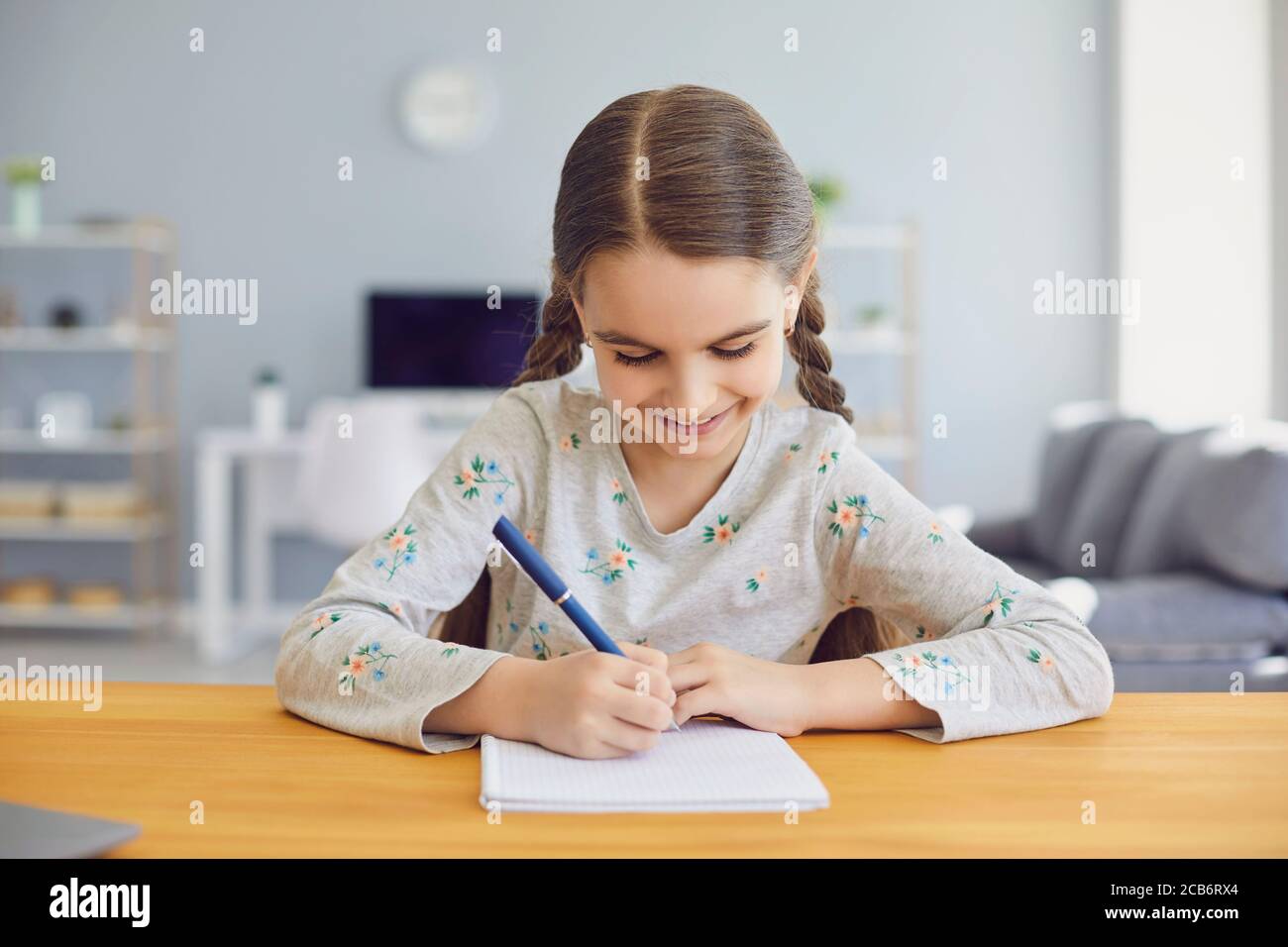 Schoolgirl writing hi-res stock photography and images - Alamy