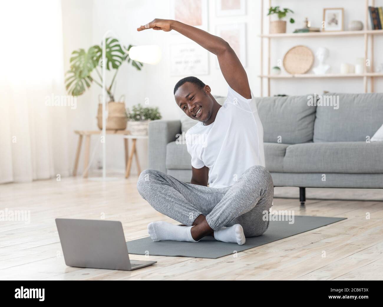 Handsome african man stretching hi-res stock photography and images - Alamy