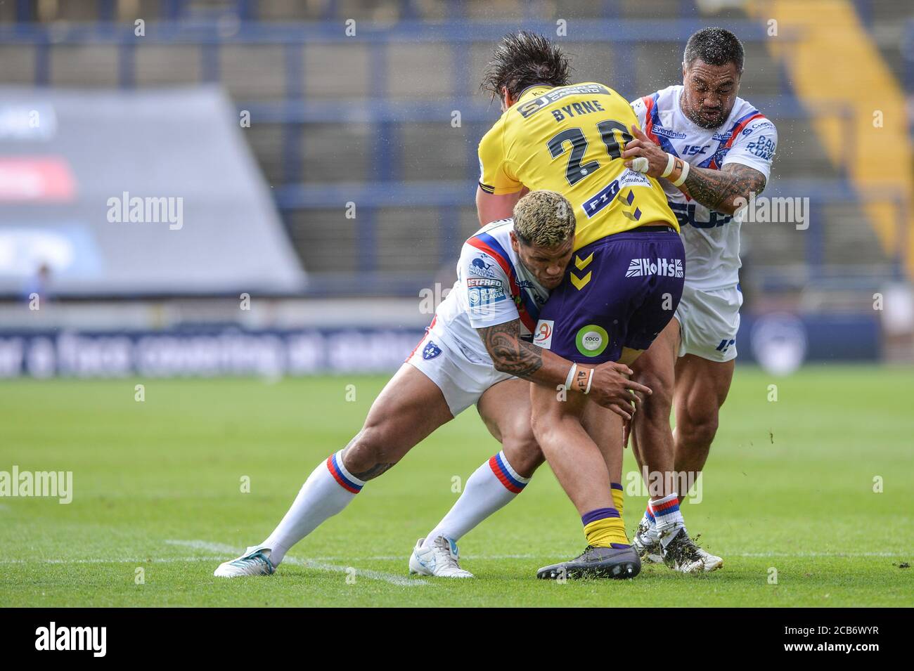 Wakefield Trinity's Adam Tangata and Tinirau Arona stop Liam Byrne of ...