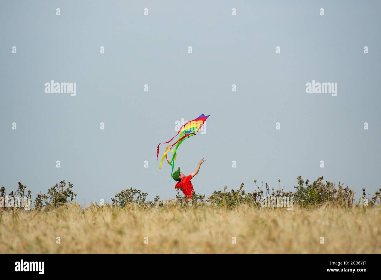 Jack, 10, plays with his kite as he enjoys the hot weather by ...
