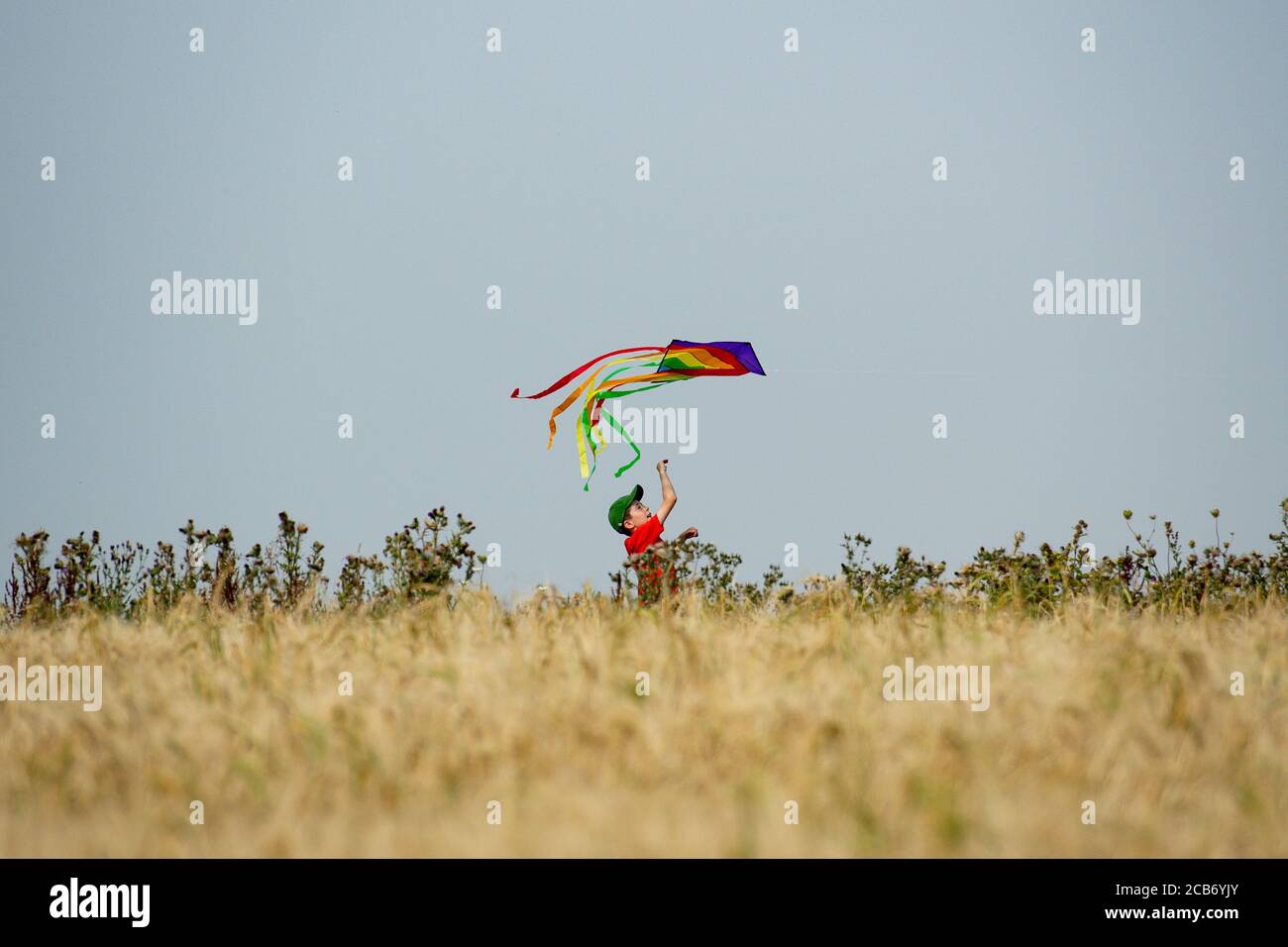 Jack, 10, plays with his kite as he enjoys the hot weather by ...
