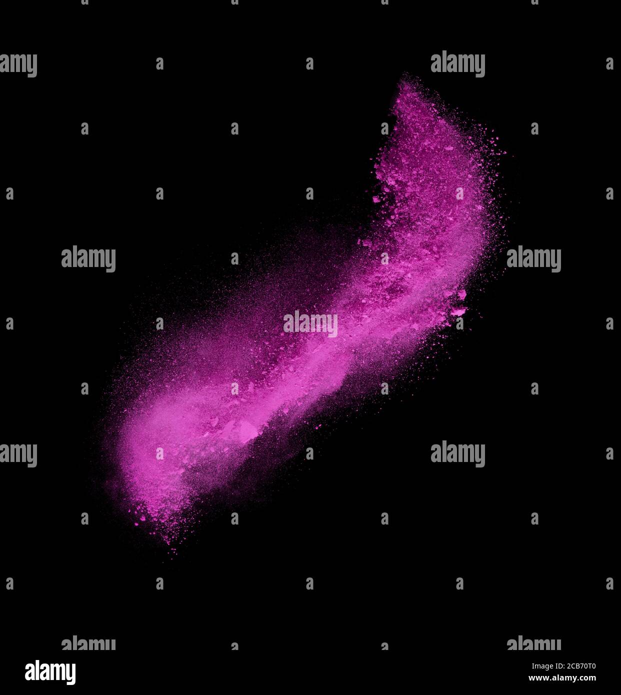 Freeze motion of pink dust explosion isolated on black background Stock ...