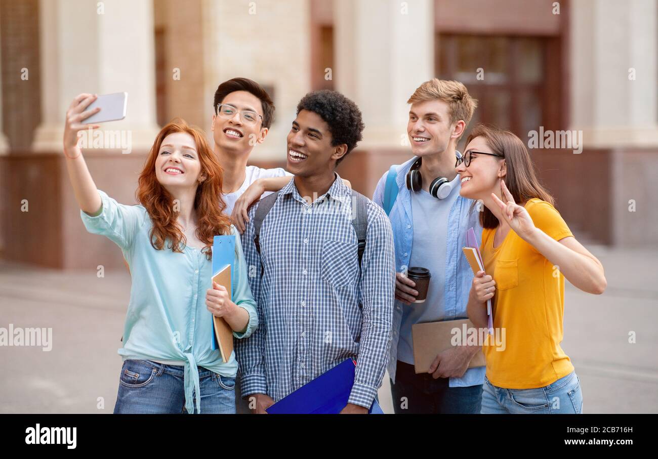 Multiracial students talking selfie using cell phone Stock Photo - Alamy