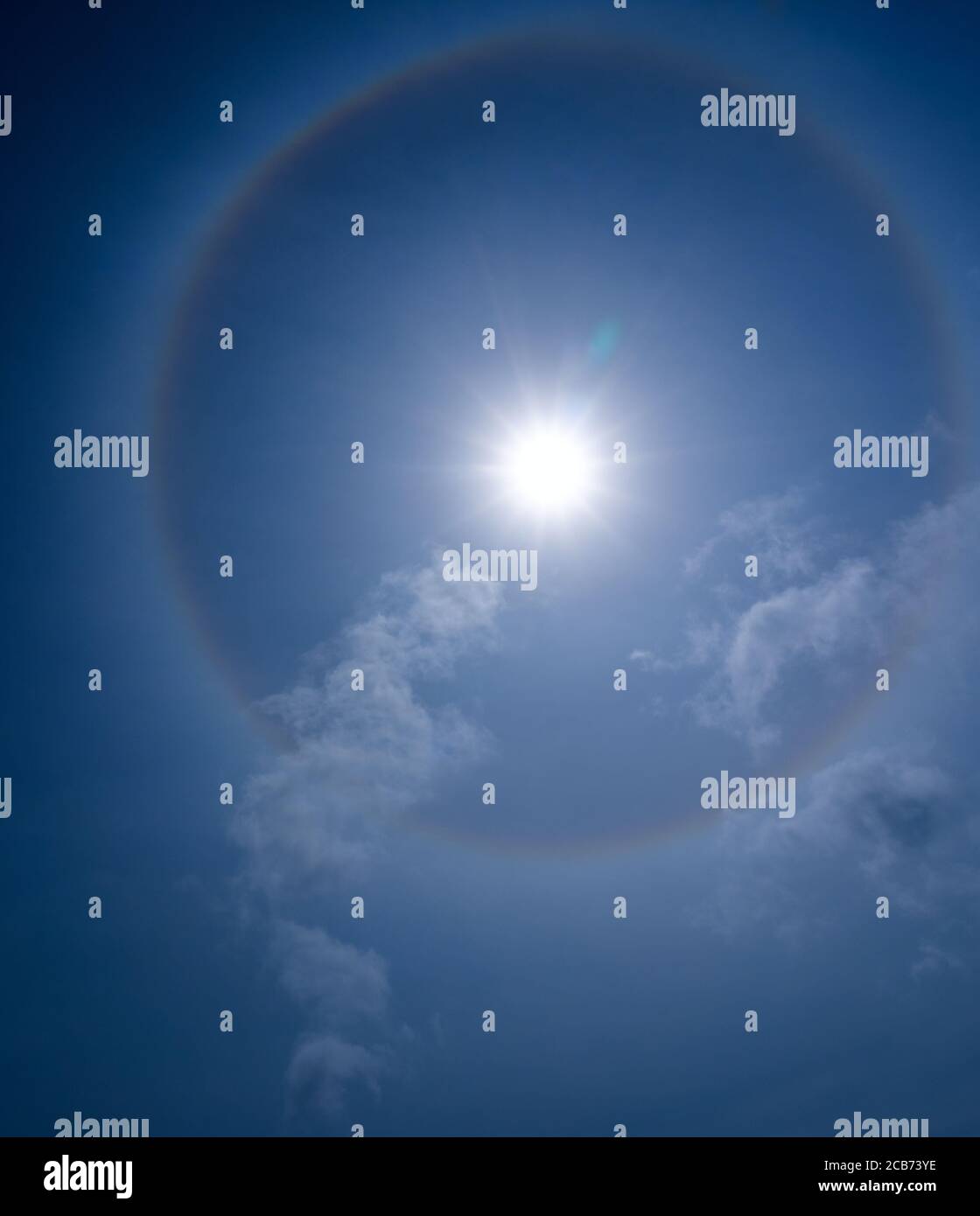 Rare phenomenon - sun halo in the blue sky Stock Photo - Alamy