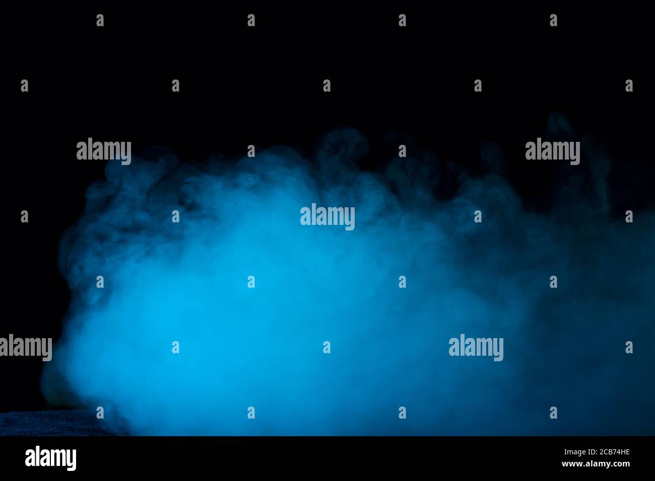 dense and mysterious blue vapor on a dark background an exciting ...