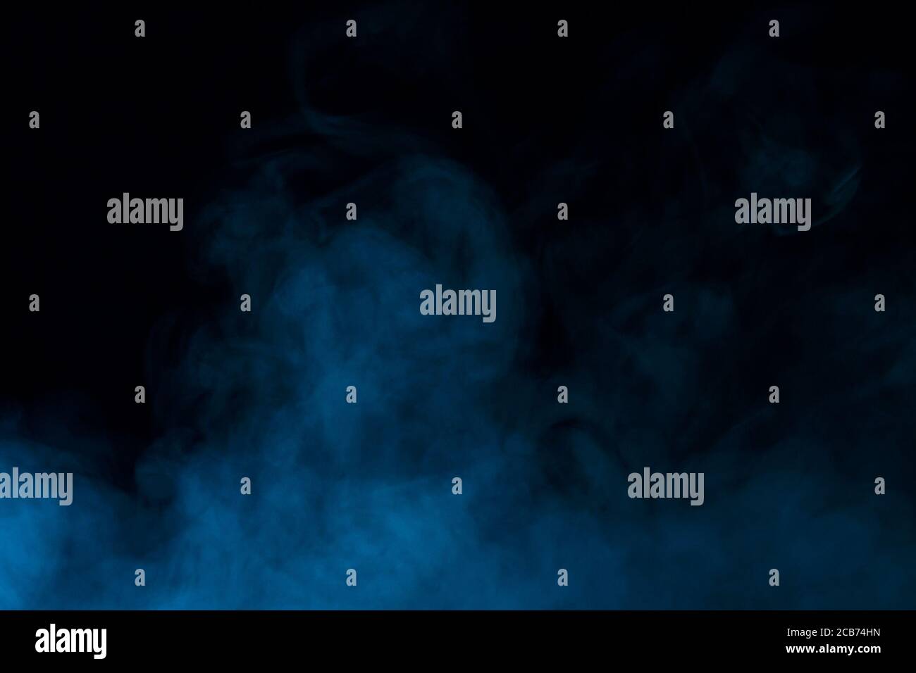 mystical blue steam on a dark background concept of smoking and ...