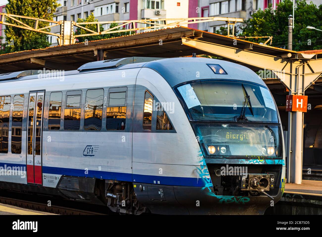 Detail of train in motion at train platform at Bucharest North Railway ...