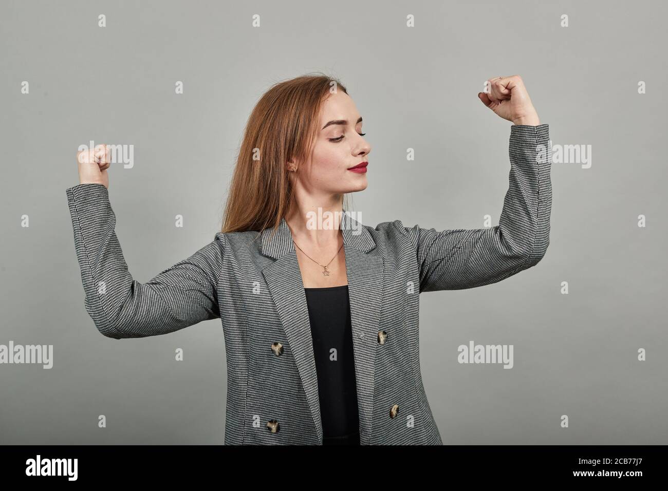 Feels proud have strength, shows great power, raises arms to show ...