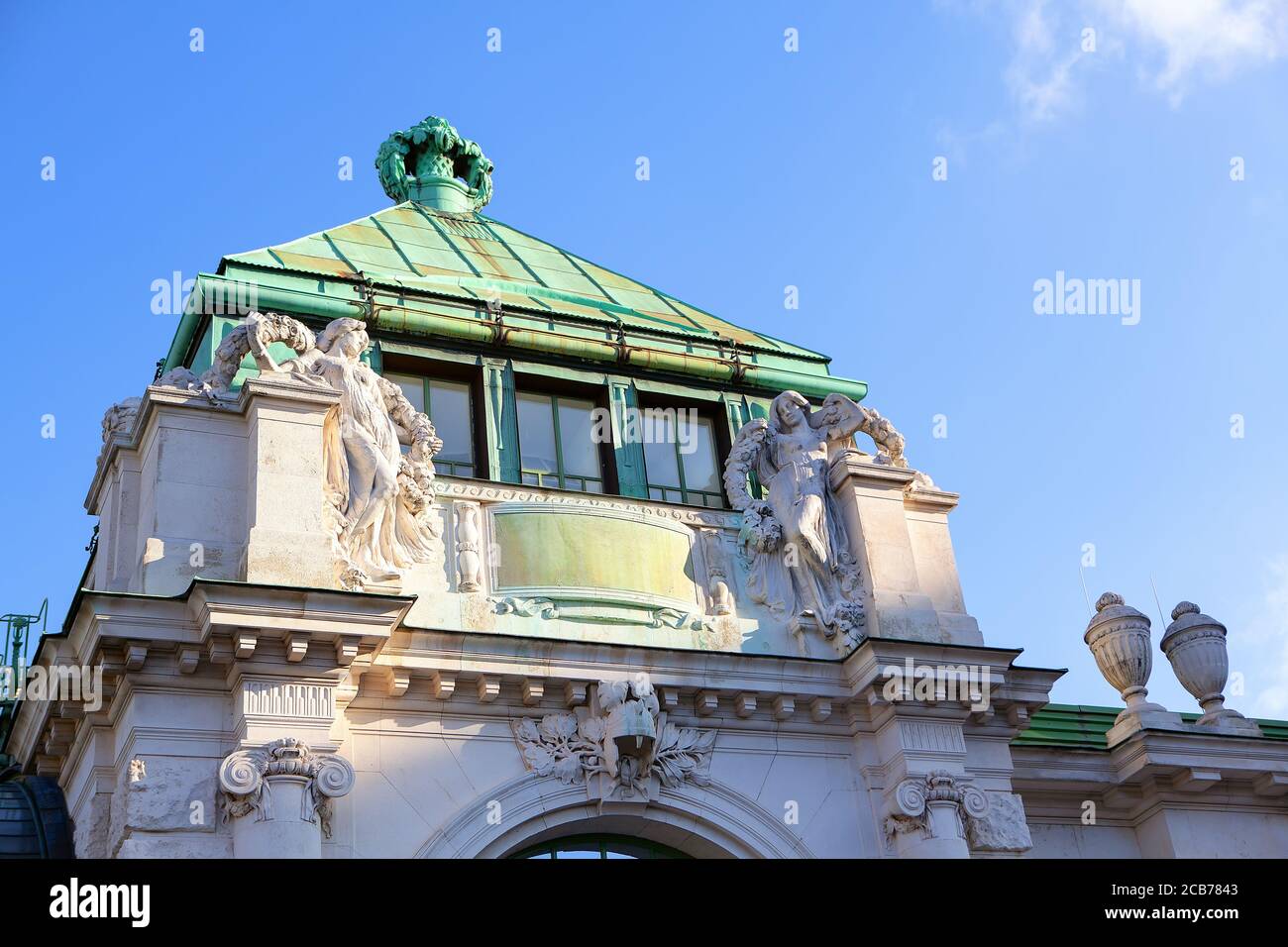 Marble sculptures of nymphs at the top part of the building . Statues ...