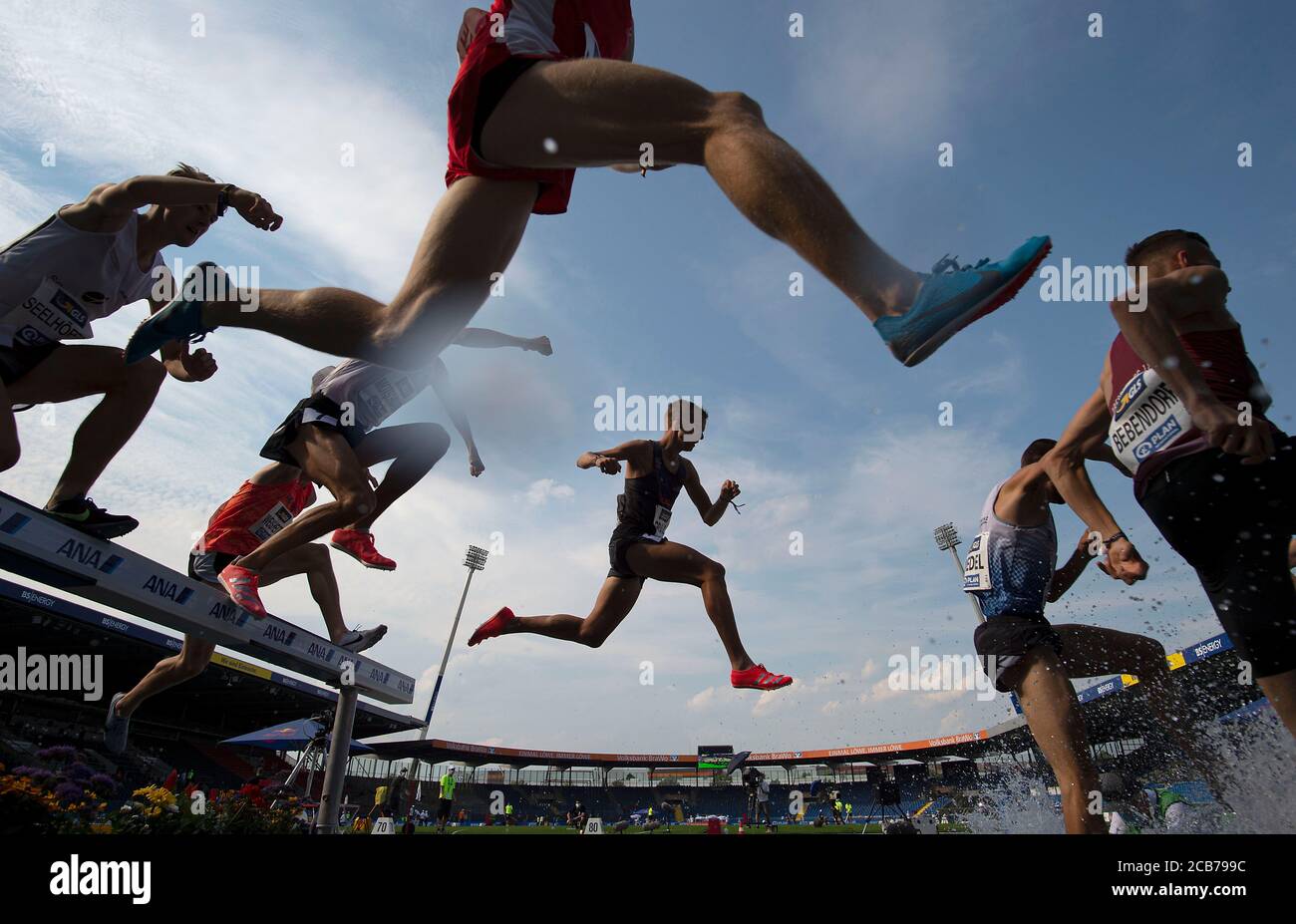 Feature runners at the moat, action, 3000m obstacle for men, on August ...