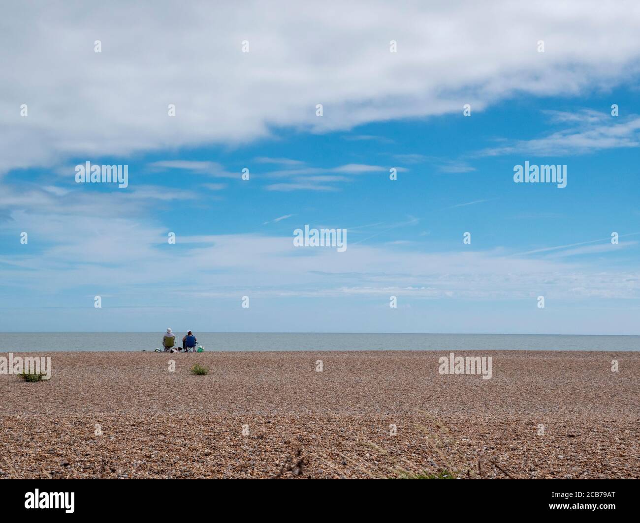 People sitting in beach chairs hi-res stock photography and images - Alamy