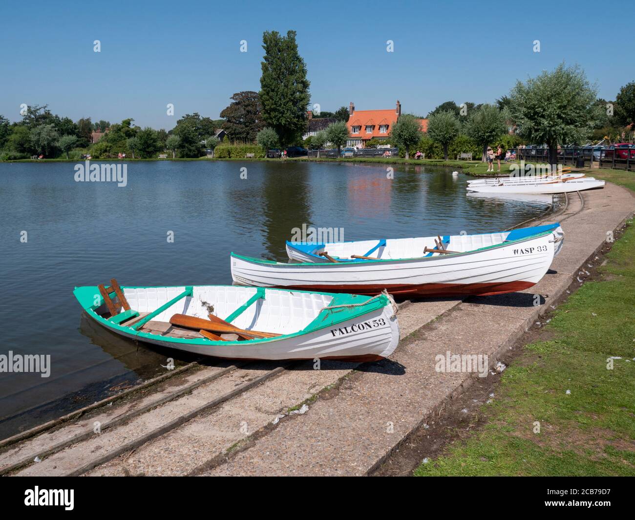 Rowing boats on the Meare boating lake at Thorpeness Suffolk UK in ...