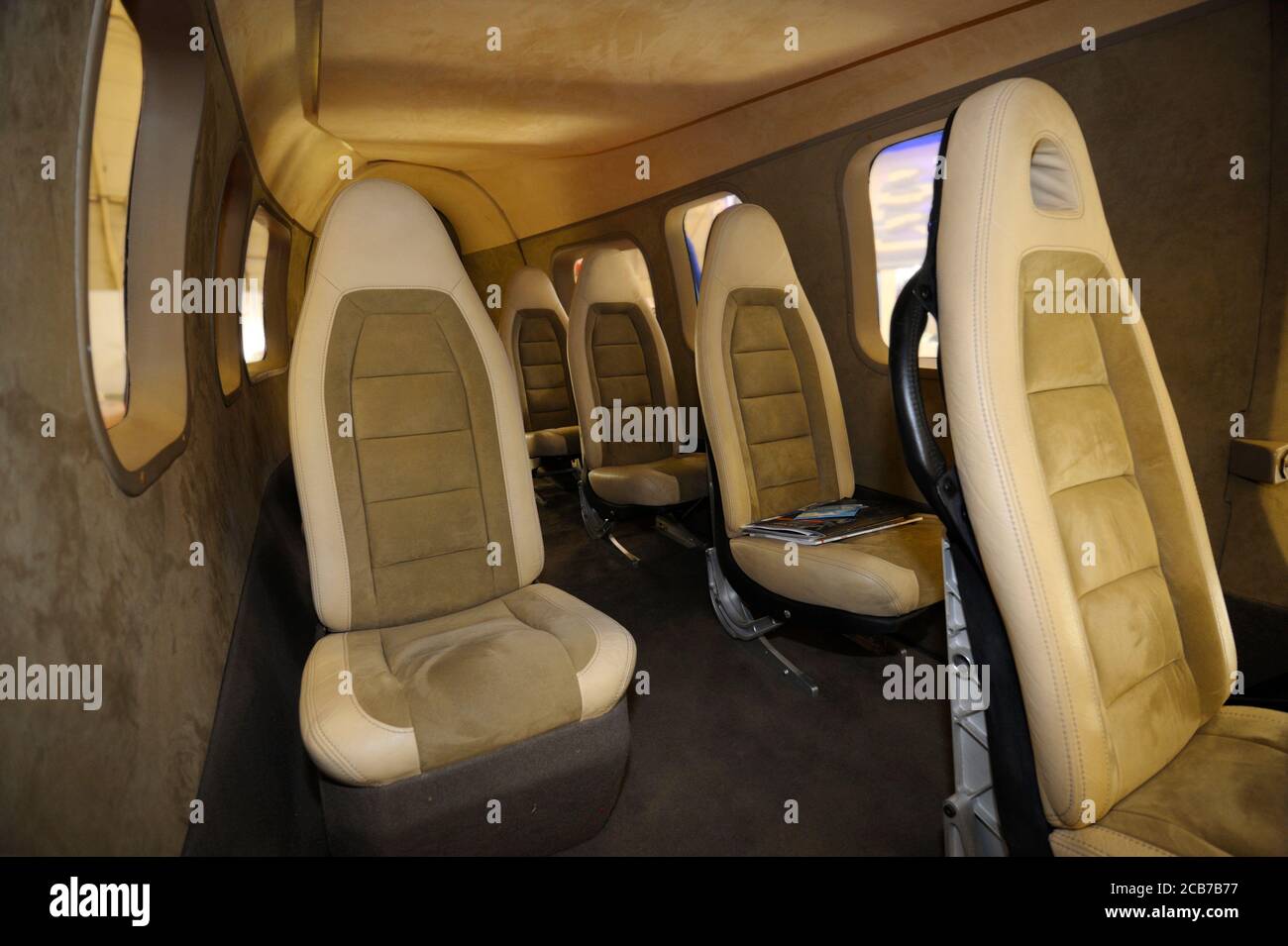 Interior of passenger helicopter salon, seats and window shades Stock ...