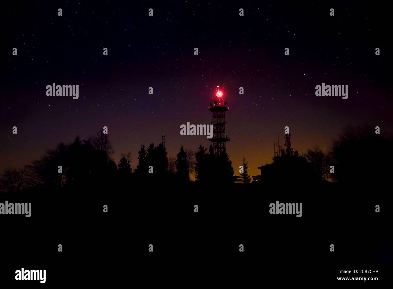 Amazing night view of the transmitter with lookout on the top mountain ...