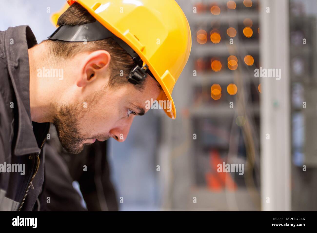 Engineer commissioning bay control unit. Engineering department. Medium ...