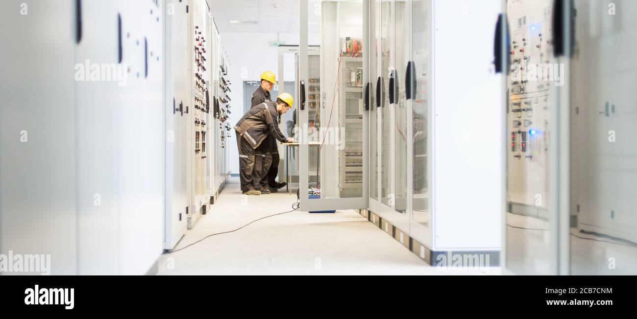 Field service crew testing electronics or inspecting electrical ...