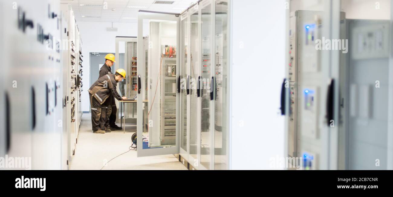 Field service crew testing electronics or inspecting electrical ...