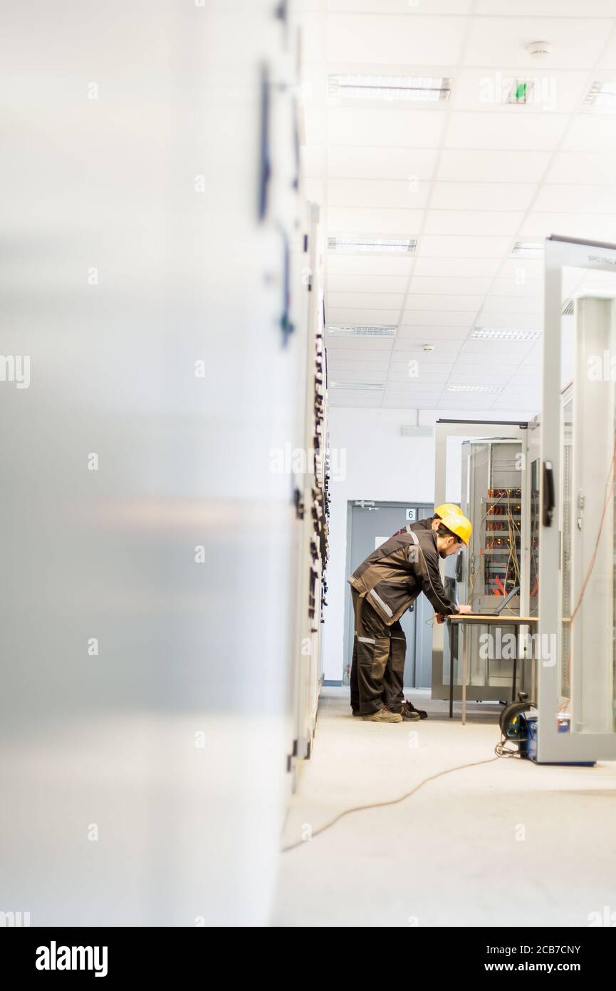 Field service crew testing electronics or inspecting electrical ...