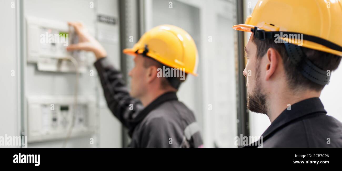 Field service crew testing electronics or inspecting electrical ...