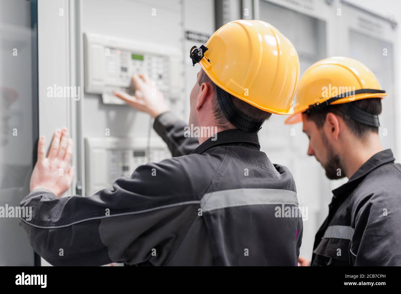Field service crew testing electronics or inspecting electrical ...