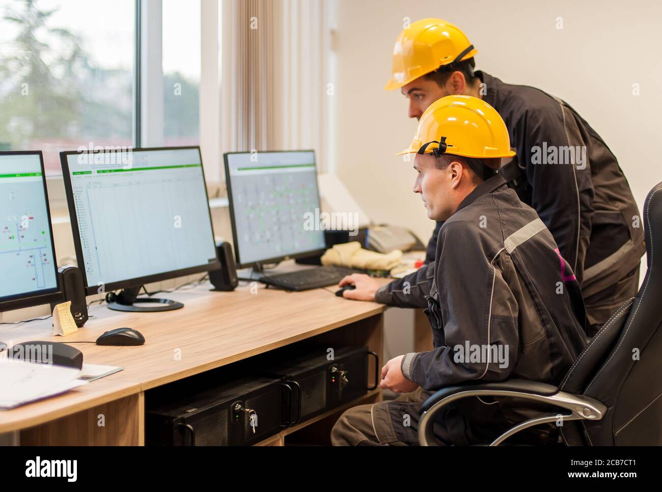 Field service crew engineers inspect relay protection system with ...