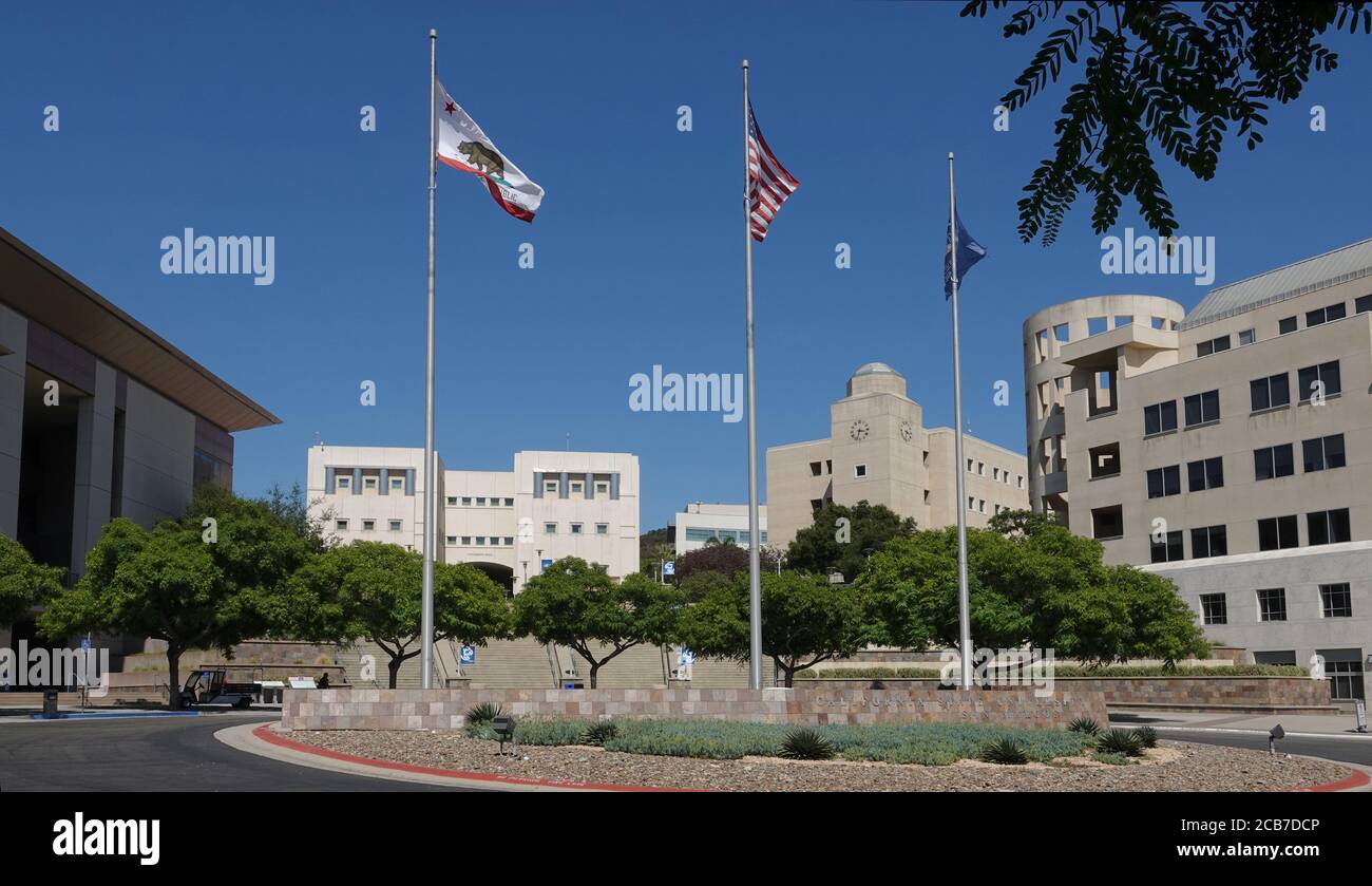 SAN MARCOS, CA, UNITED STATES - Jul 21, 2020: Flagpoles at entrance to ...