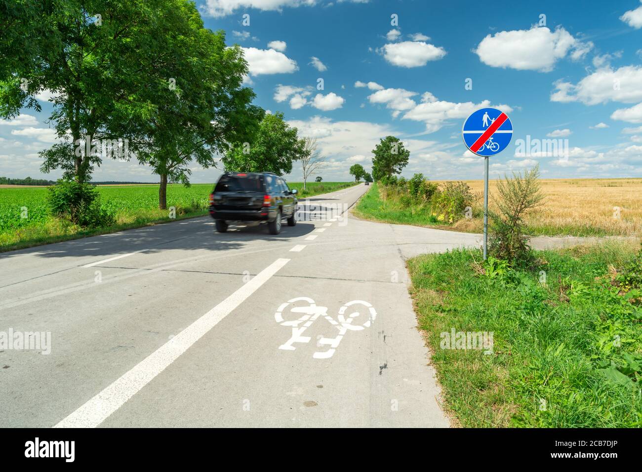 Bike path white signs hi-res stock photography and images - Alamy