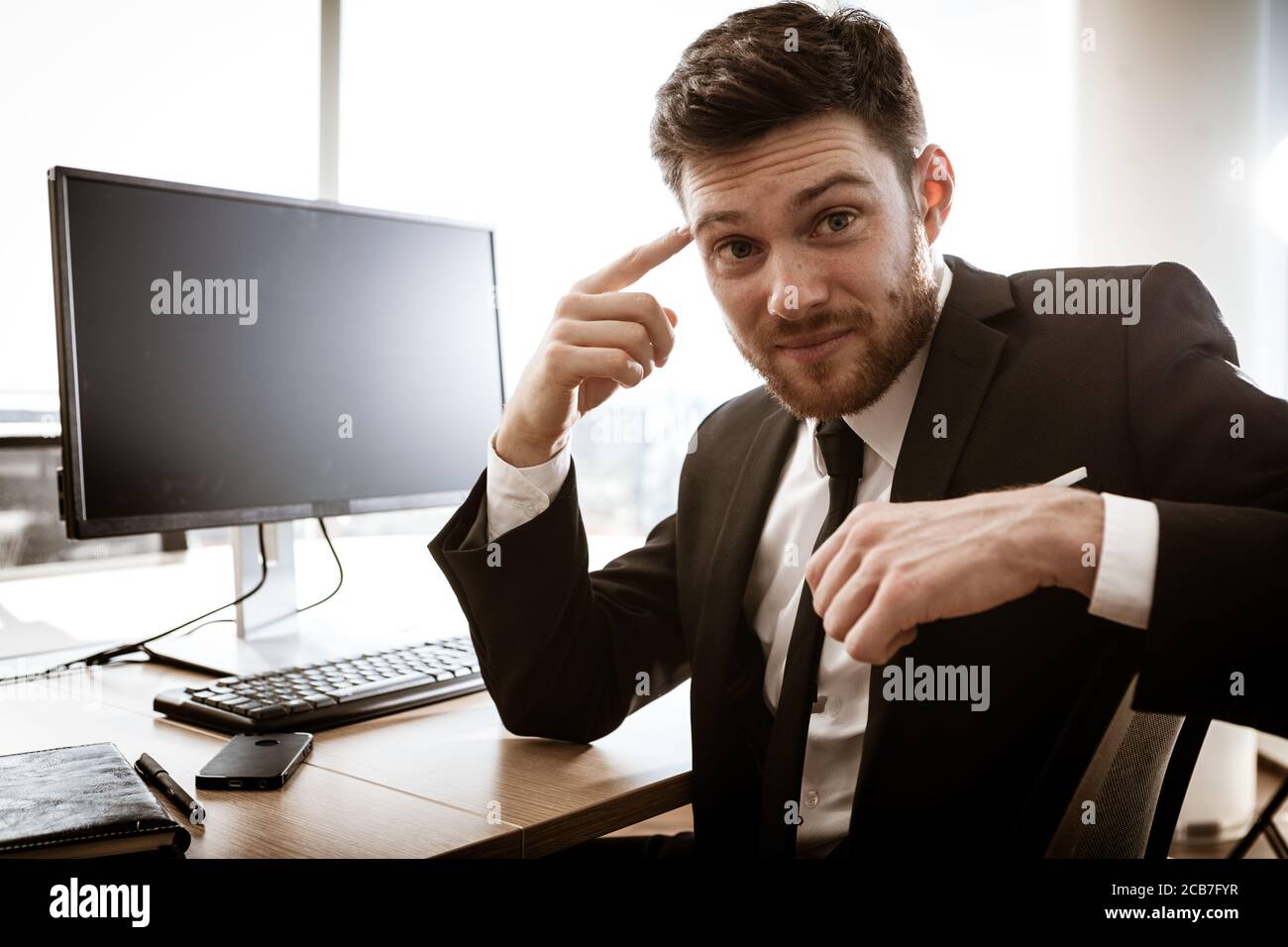 Business crisis concept. Emotional young businessman at work. Worried ...