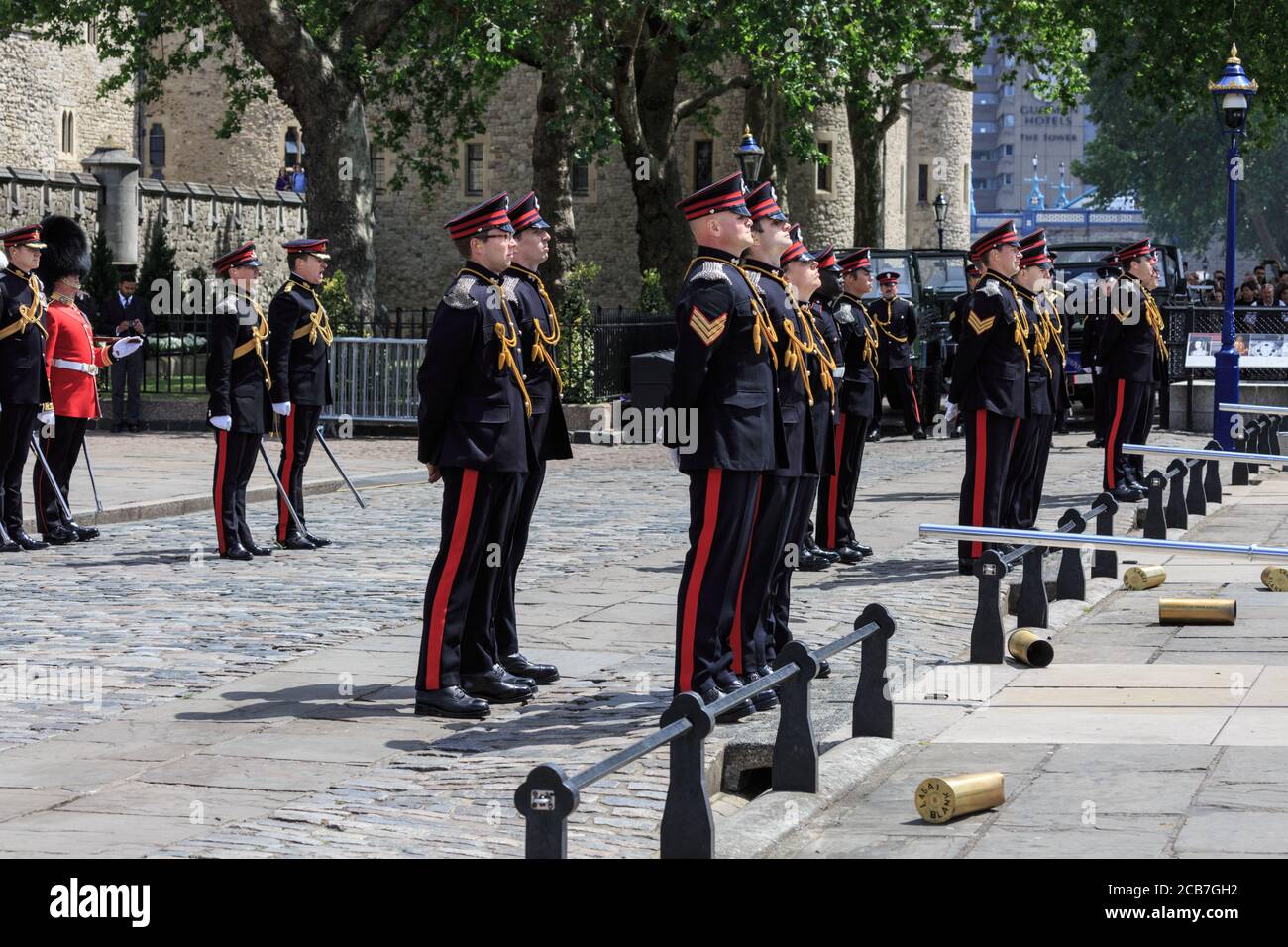 Soldiers stand to attention during the salute fired by the Honourable ...