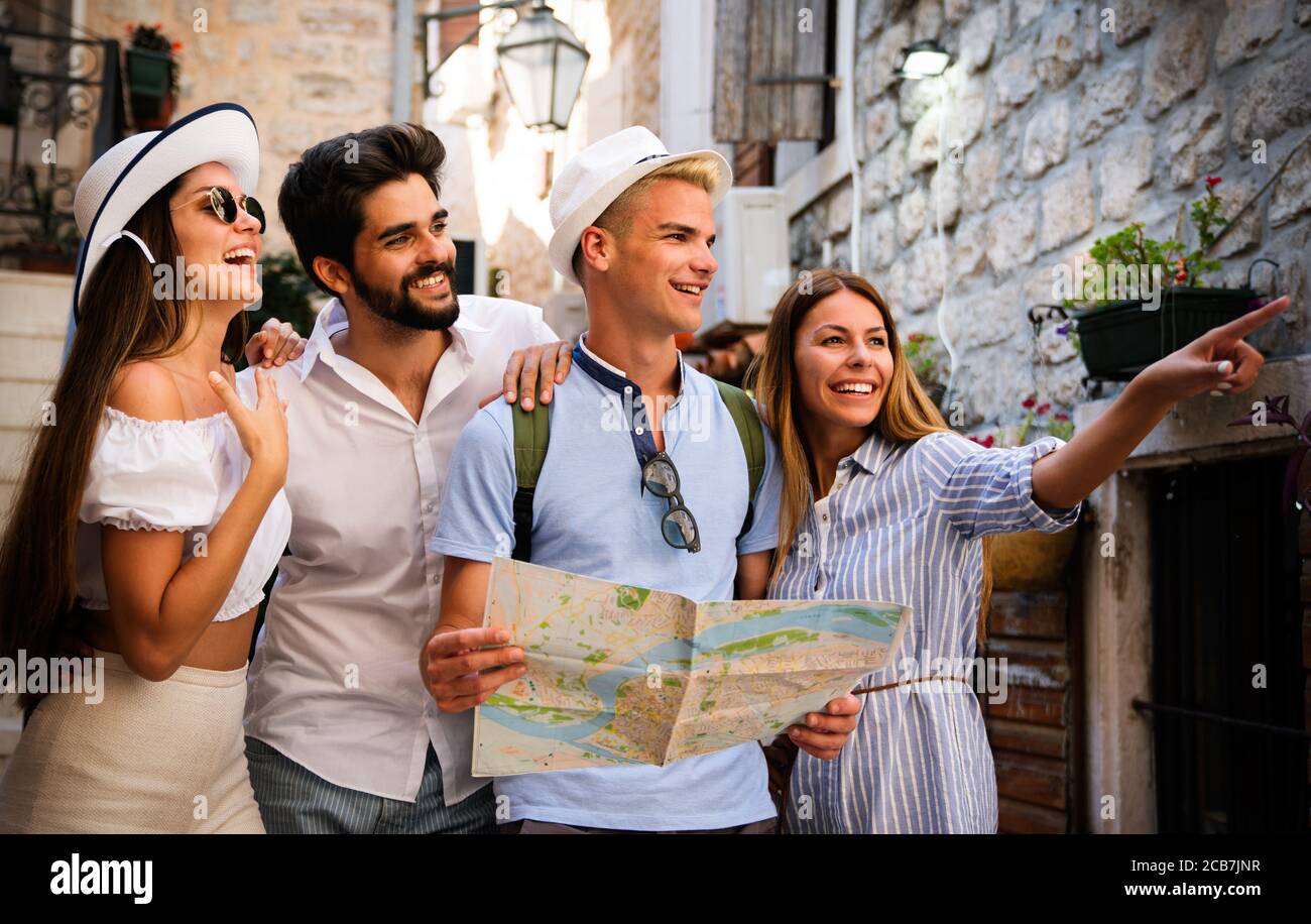 Happy group of friends enjoying travel and vacation Stock Photo - Alamy