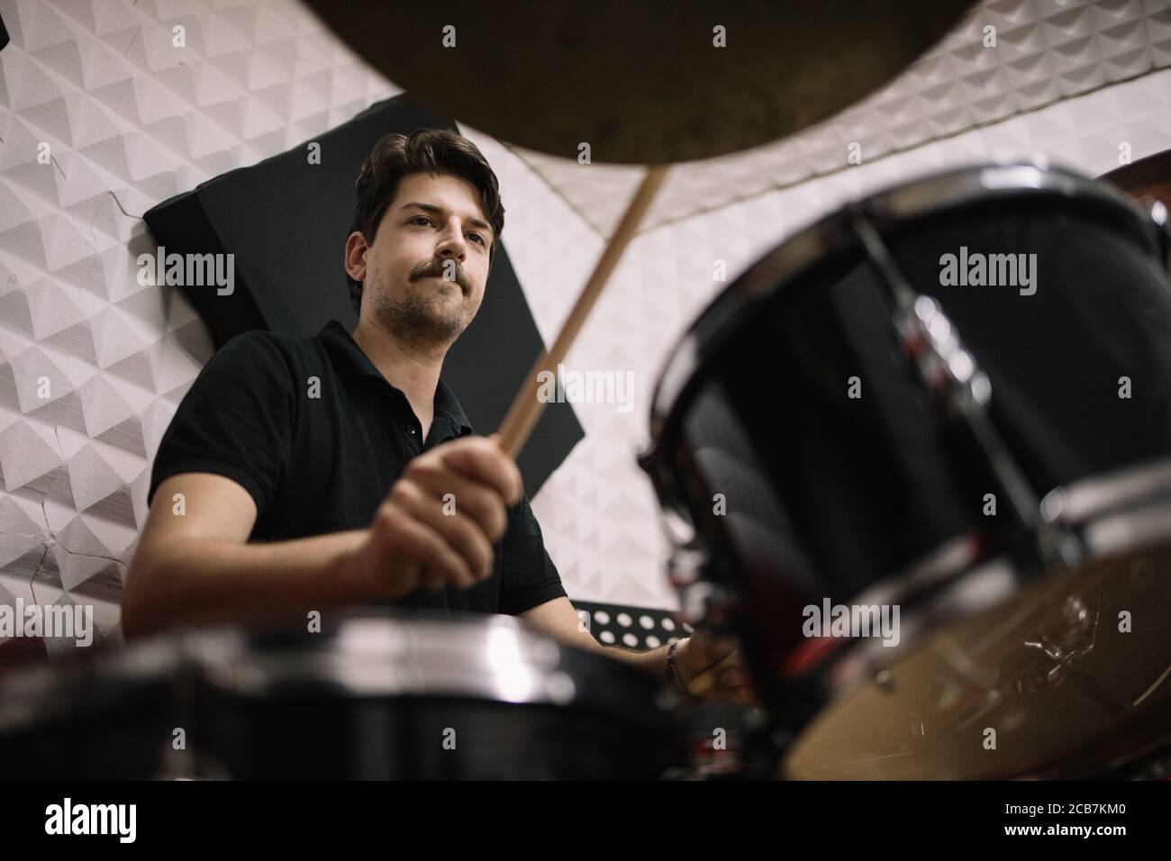 Handsome man with drumsticks hi-res stock photography and images - Alamy