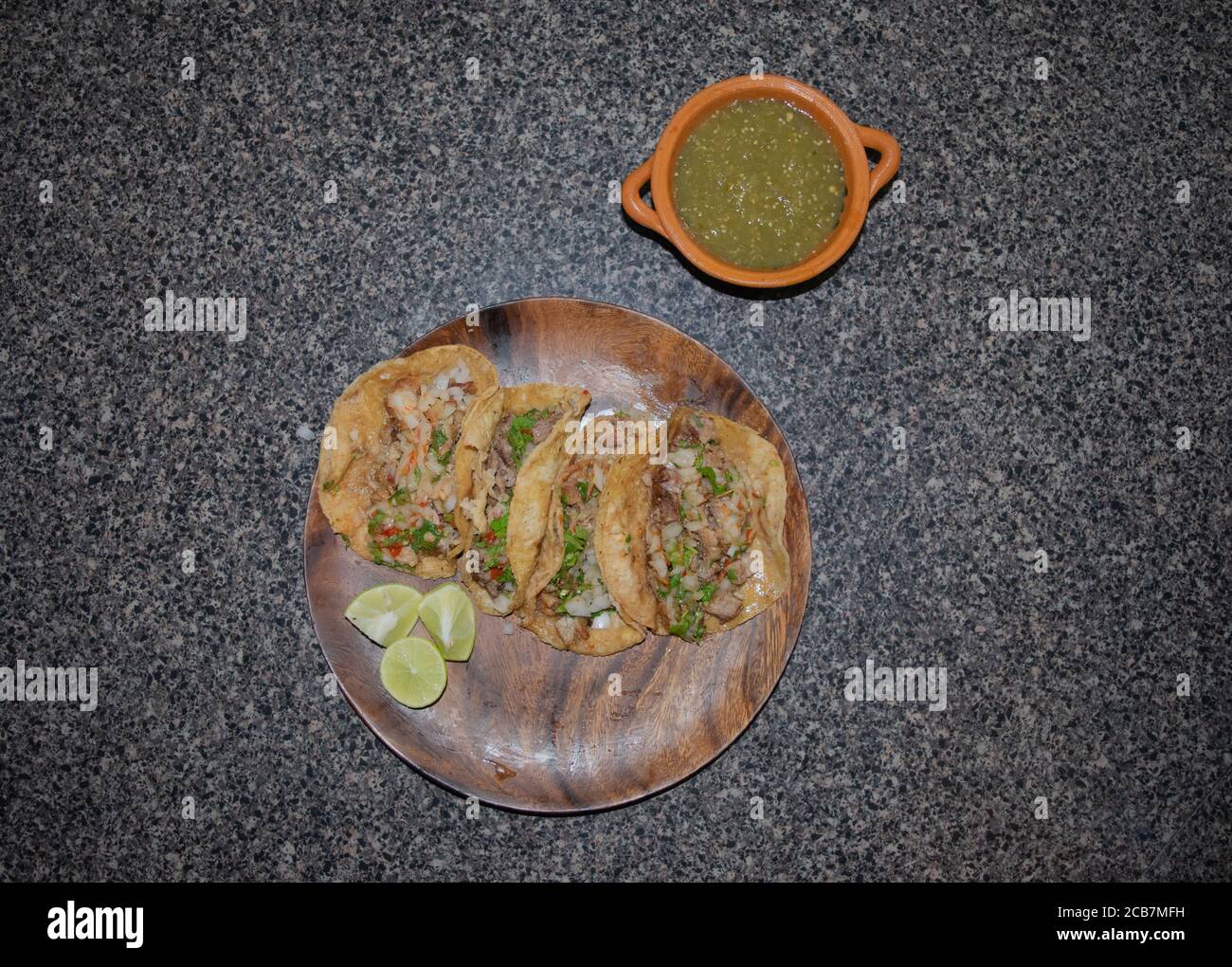 top view of Mexican street tacos with tripe, steak and suadero and ...