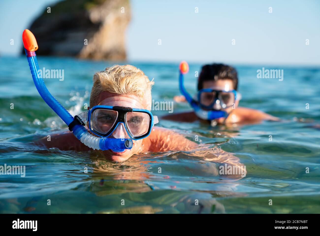 Happy friends men enjoying summer vacation and scuba diving Stock Photo ...