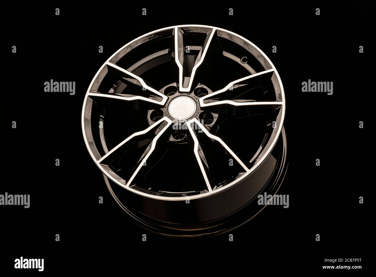 black alloy wheel with black curved spokes. Unusual stylish design ...
