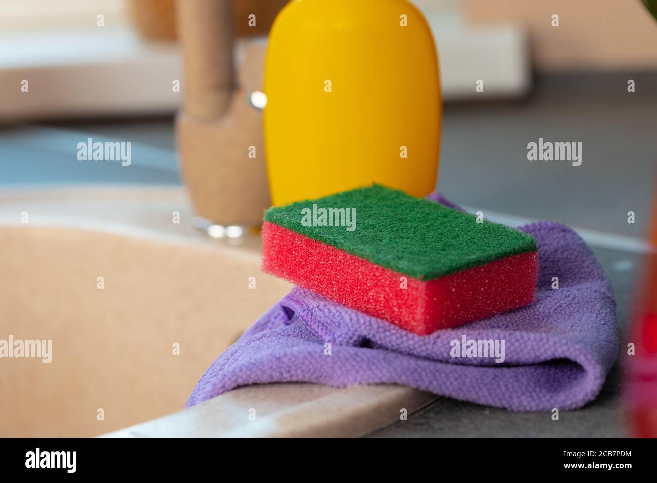 Cleaning sponge and rag on kitchen counter Stock Photo - Alamy