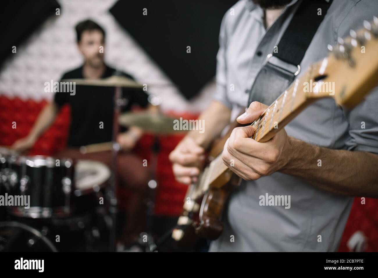 Blurred male rock musician playing electric guitar Stock Photo - Alamy