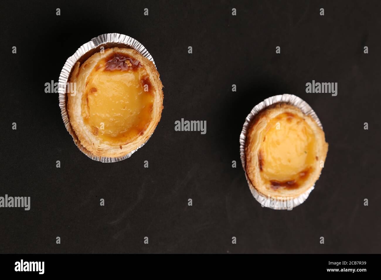 Closeup shot of freshly baked round desserts in foil forms Stock Photo ...